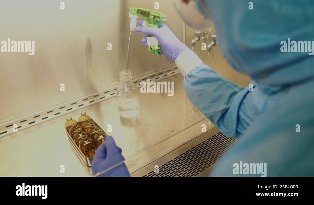 Scientist In Full PPE Using Pipette In Clean Room. Slow Motion, Follow ...