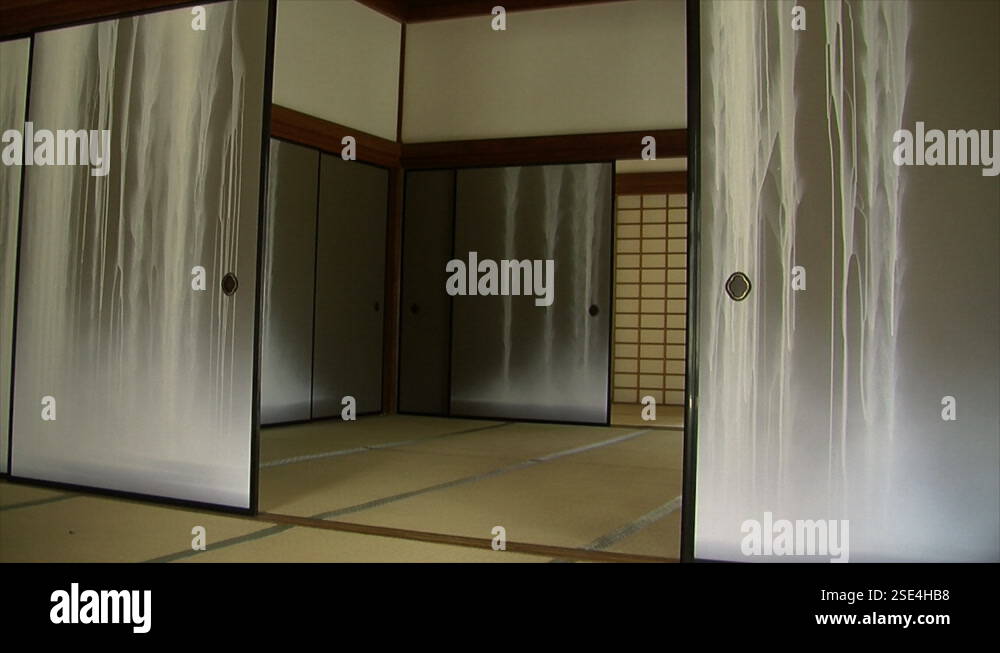 Painted fusuma walls and tatami mats in a traditional Japanese house ...