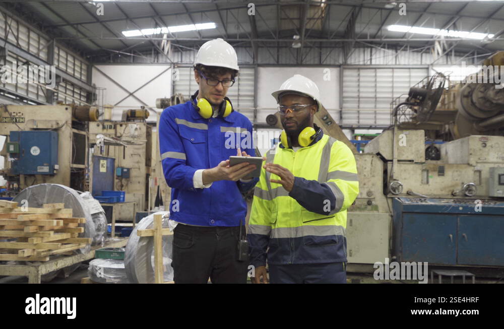 Portrait of western worker, caucasian and black african, engineer team ...