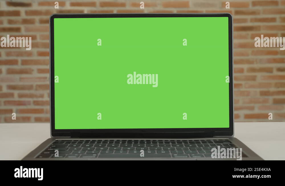 Close up display computer desktop with mock-up green screen on white ...