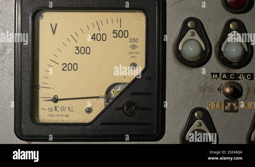 The voltmeter hand rises when the electric panel is switched on Stock ...