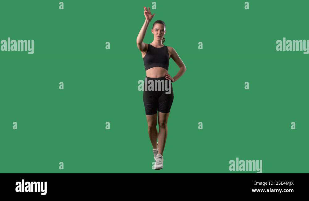 Motivated fit woman countdown 5 to 0 with fingers. Full body on green ...