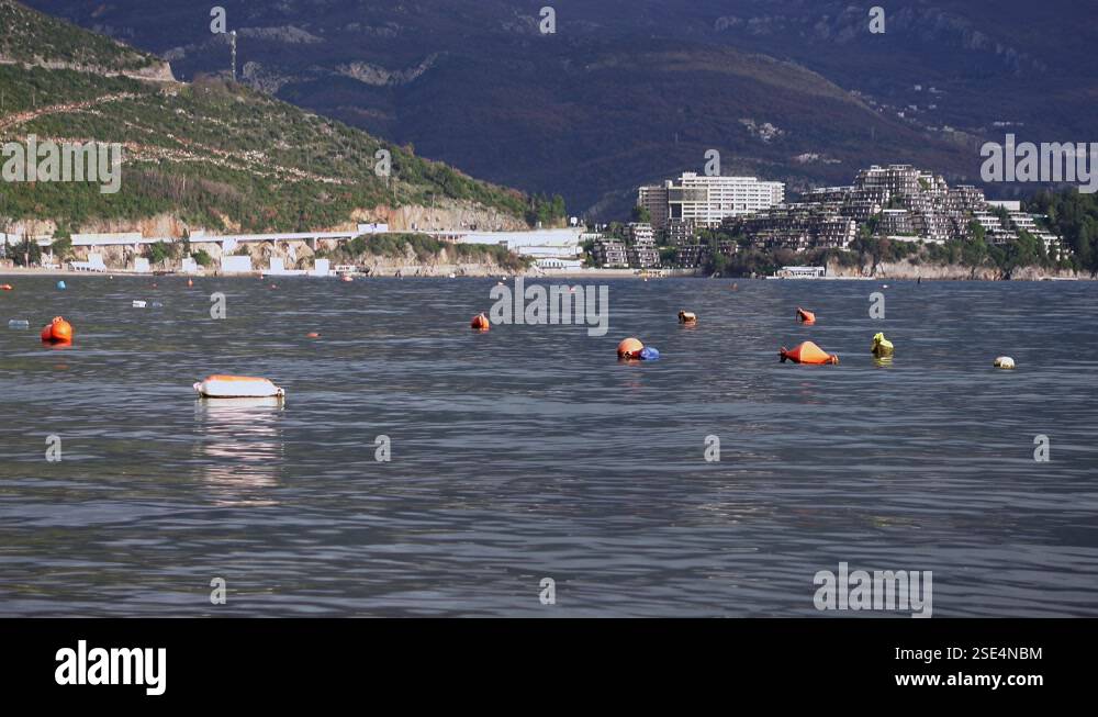 Bright buoys float on surface of water marking dangerous depth for ...