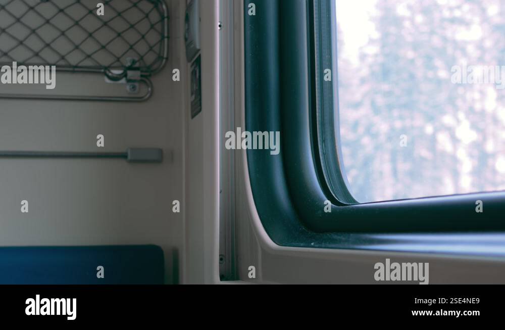 The second-class cabin of a passenger train without passengers. From ...