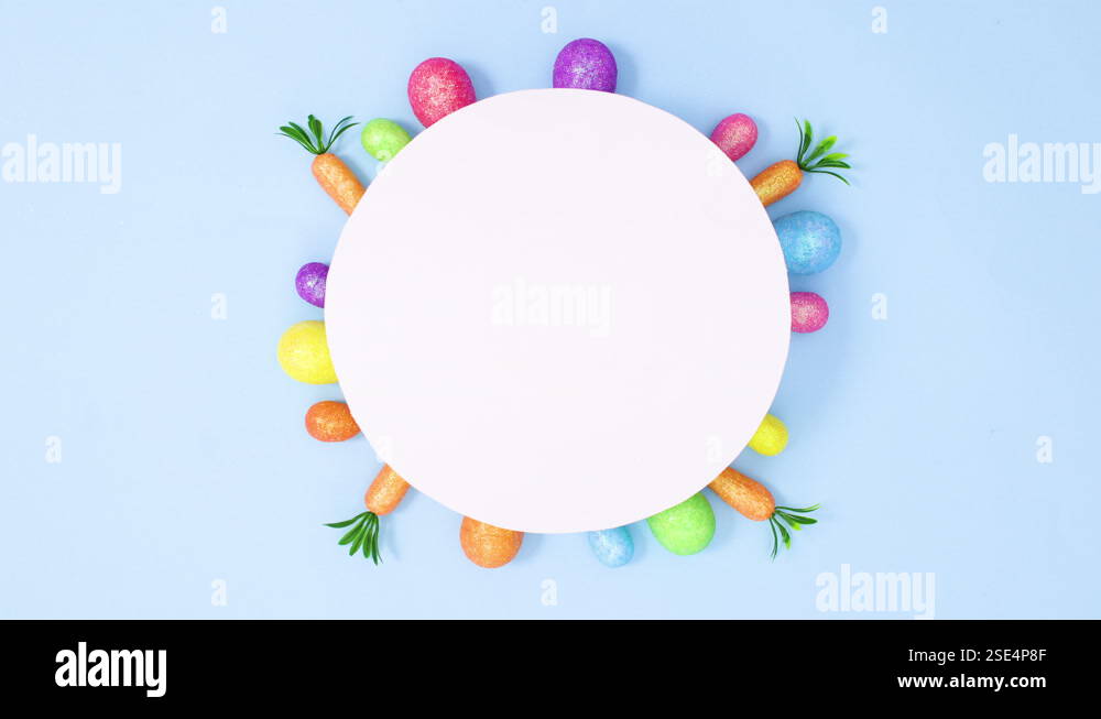 Easter eggs appear around paper card note on bright blue background. Stop motion Stock Video ...