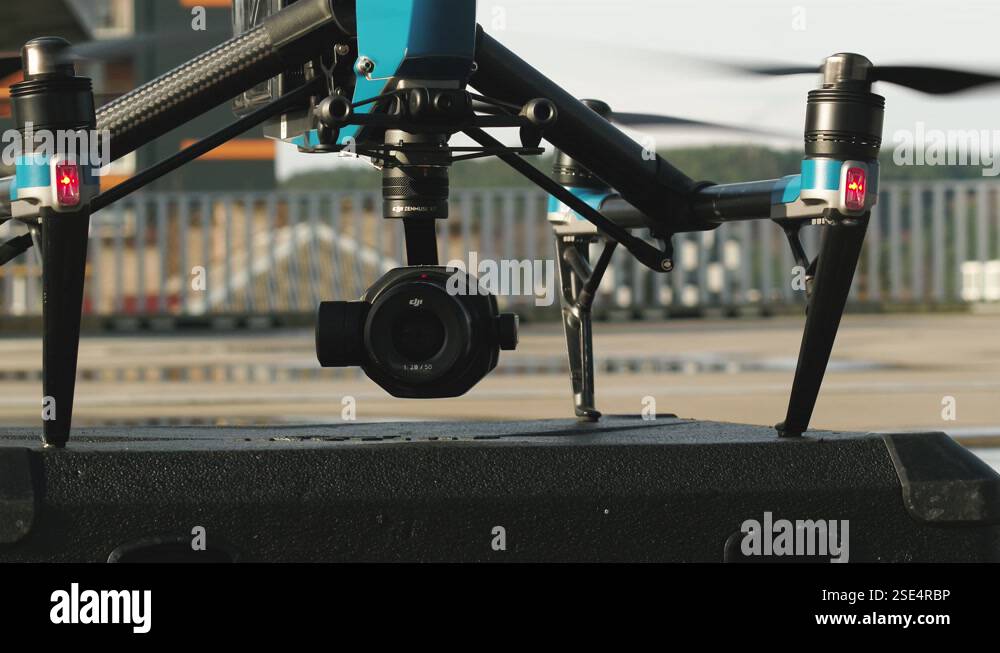 Large DJI Inspire drone turning on and propellers starting to rotate ...