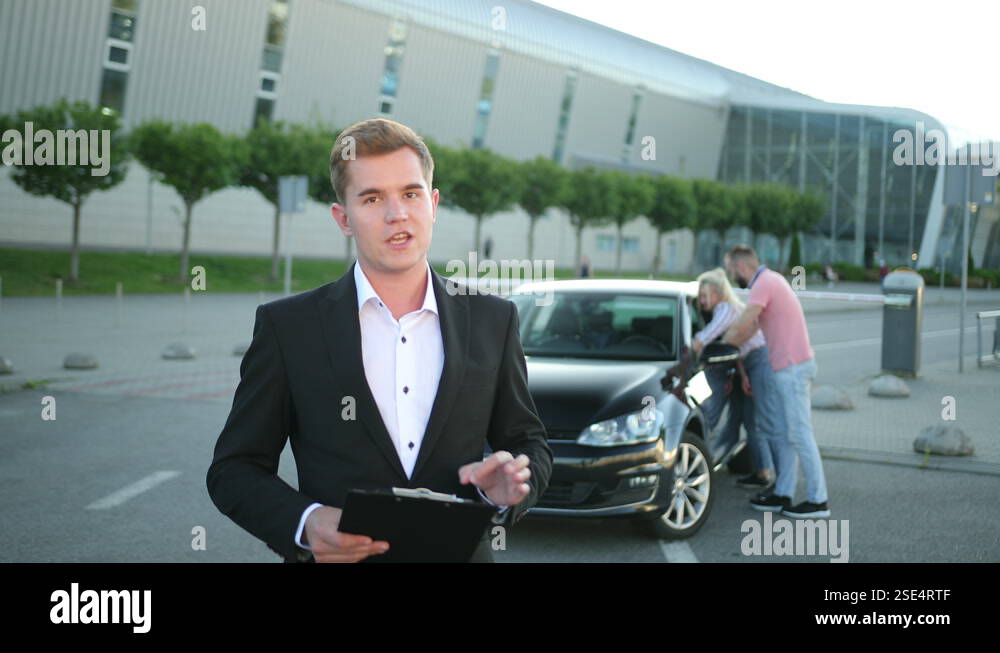 Sales salesman consultant with folder in his hand in suit sells car ...
