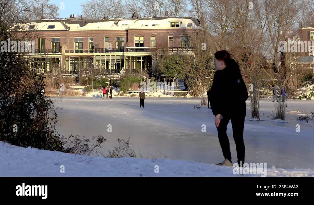 Sideways moving time lapse showing people in winter snow landscape ...
