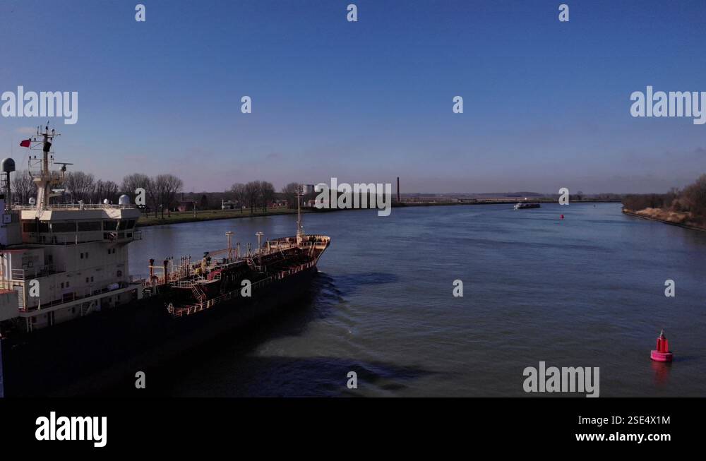 Freight cargo ship in the river. Aerial view by drone on the water ...