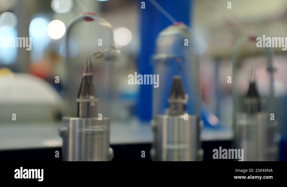 several threads are pulled through the rotating parts of the textile ...