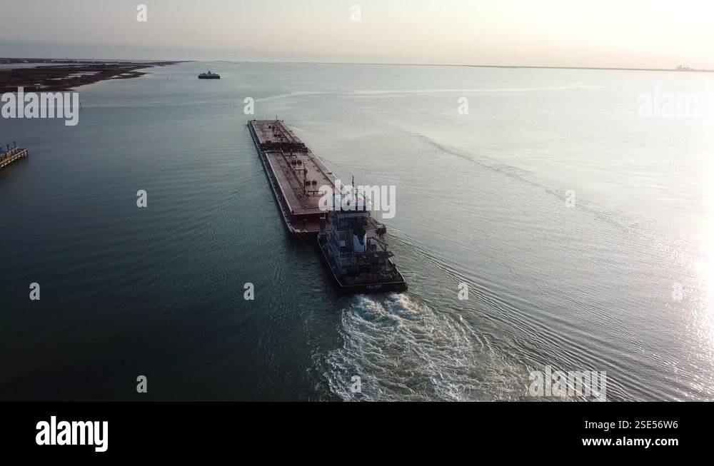 Aerial View - Red barge following another barge in the Gulf ...