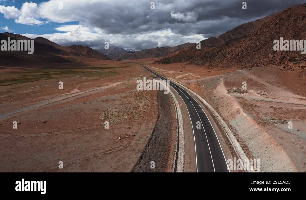 Beautiful paved road in the mountains. New highway. Road trip through a ...