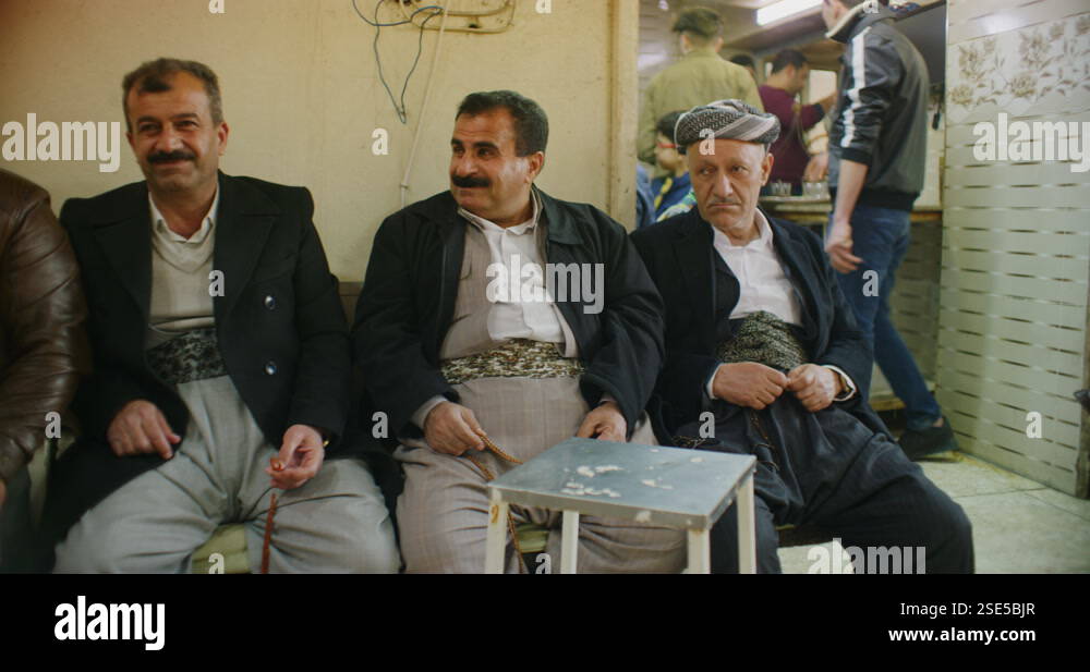 Portrait of Men As They Sit, Relax And Drink Tea Near The Citadel in ...