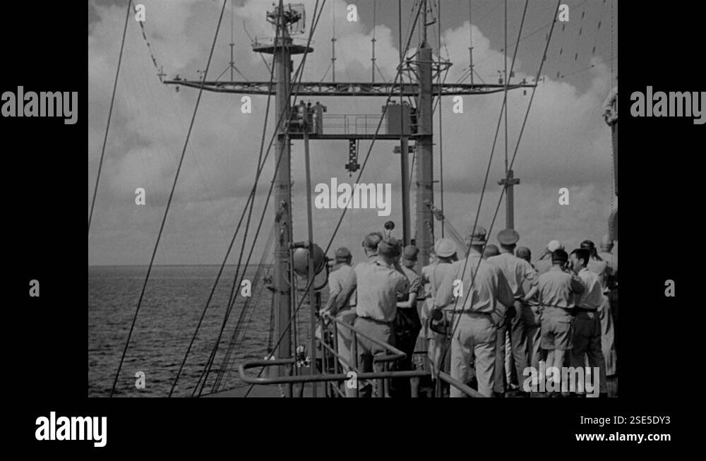 1940s: Officers, sailors, soldiers, on deck of Navy ship at sea ...