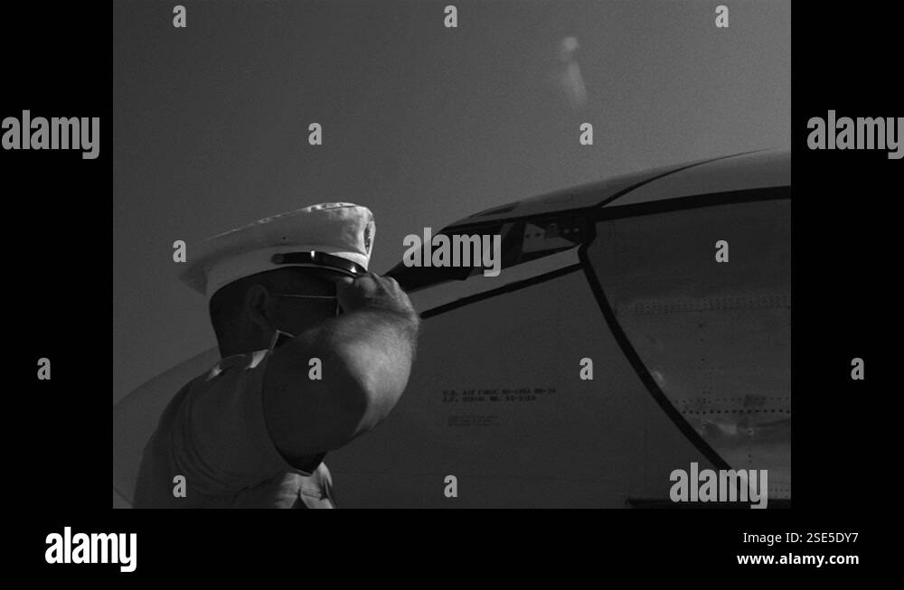 1960s: soldier saluting in front of plane, man taxiing plane on runway ...
