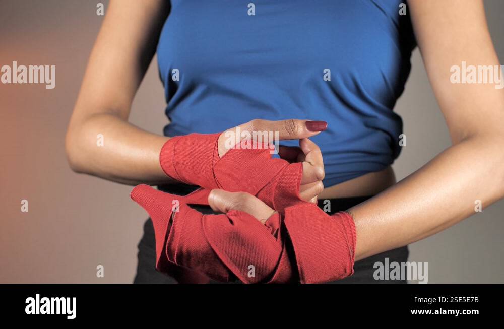 Indian female fighter wrapping boxing bandages - kickboxing training ...