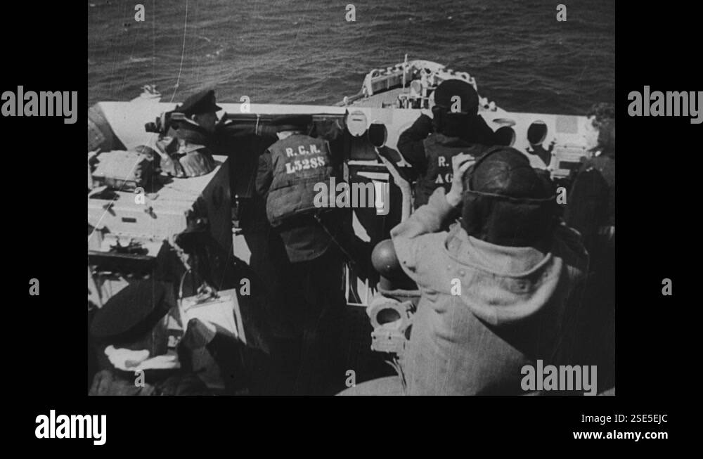 1940s: Captain stirs Navy ship. Cannon on ship turns. Soldiers load ...