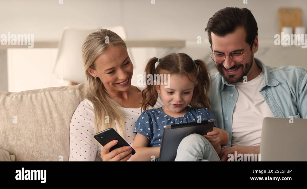 Addicted with modern gadgets family spend time using diverse devices ...