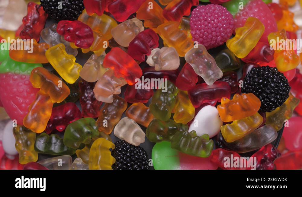 sweet colorful candy gummy rotating 4k Stock Video Footage - Alamy