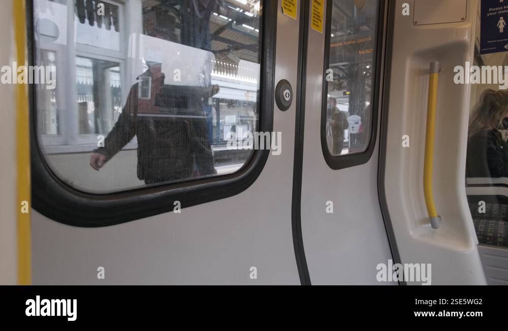 London underground District line train pulling into Turnham green ...