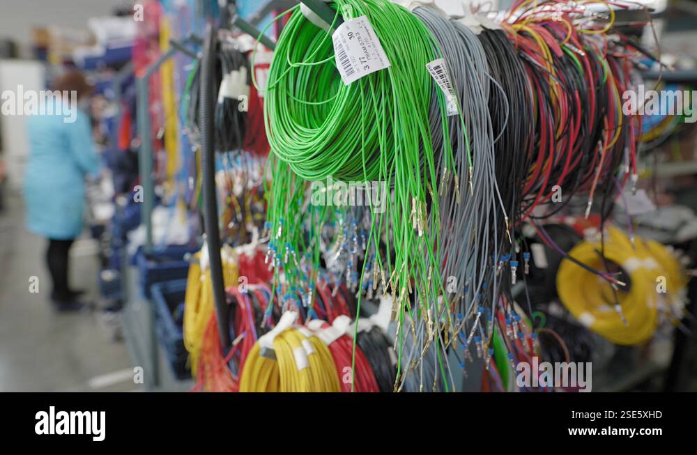 Colored wires in a workshop for the production of car wiring. Different ...