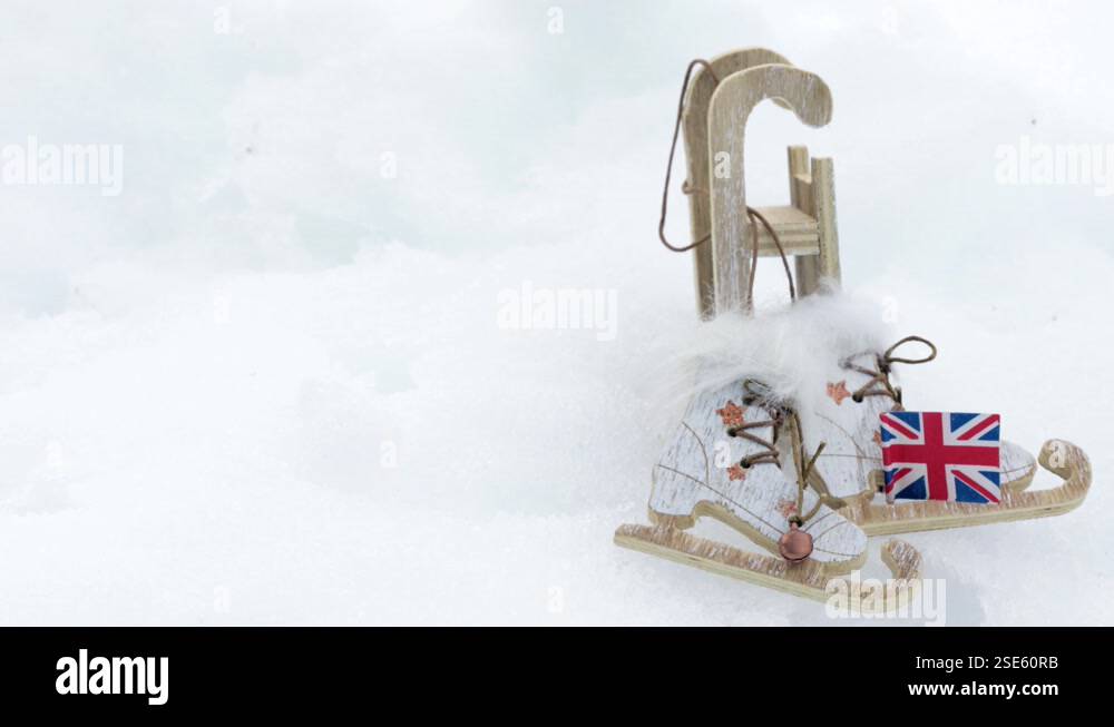 Winter sport equipment sledge, skating shoes and British flag Stock ...