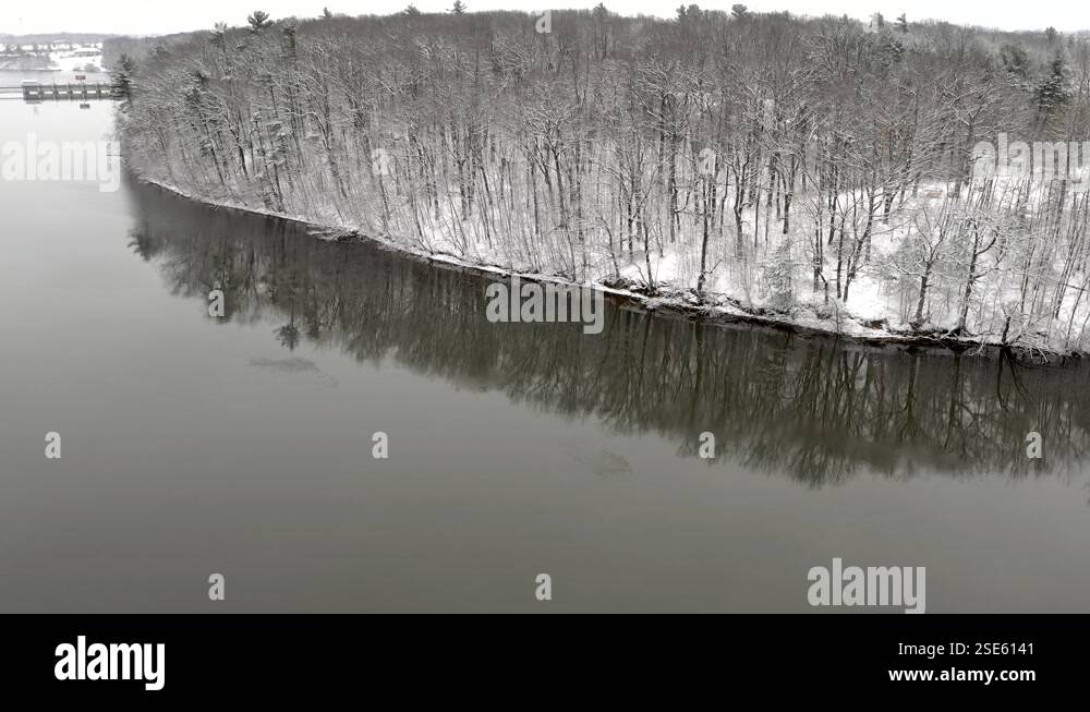 Riverside trees covered in fresh snow after a Springtime snowfall Stock ...