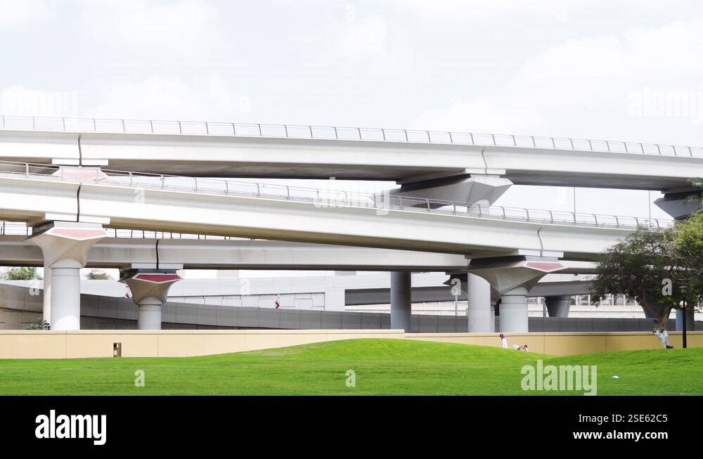 Lofty Archways Of Dubai Metro Train From Al Rashidiya Park With People ...