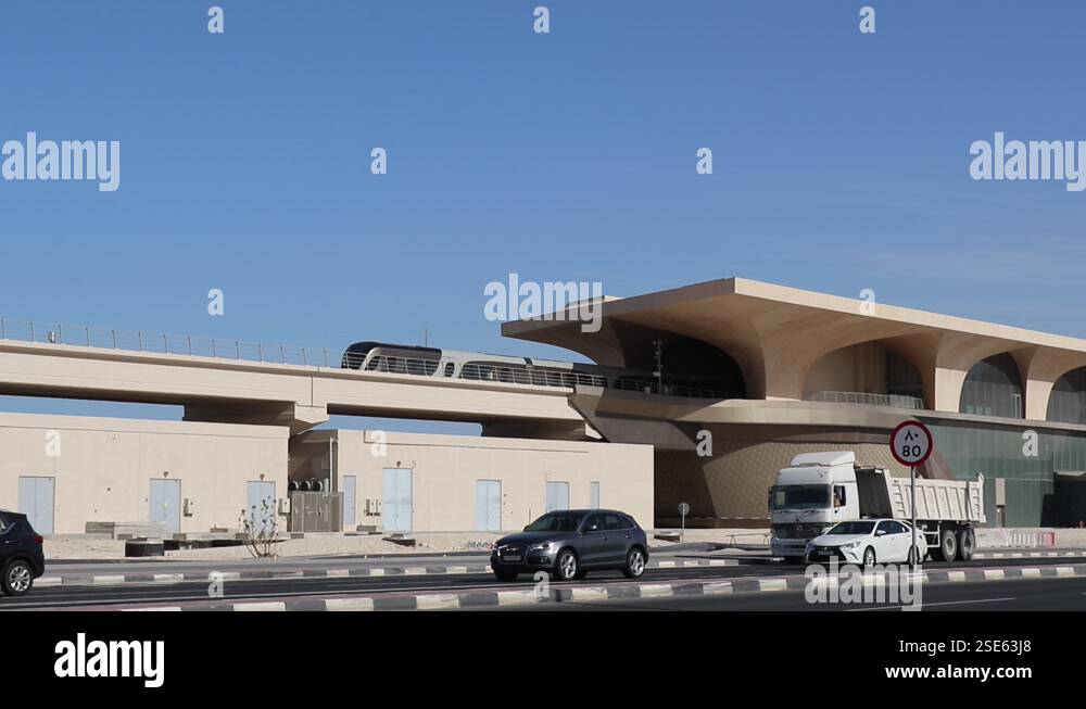 A view of Metro train through flyover above the highway departing from ...