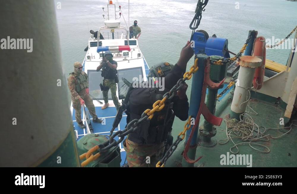 Special Forces sailors ascending ladder to board ship for VBSS exercise ...