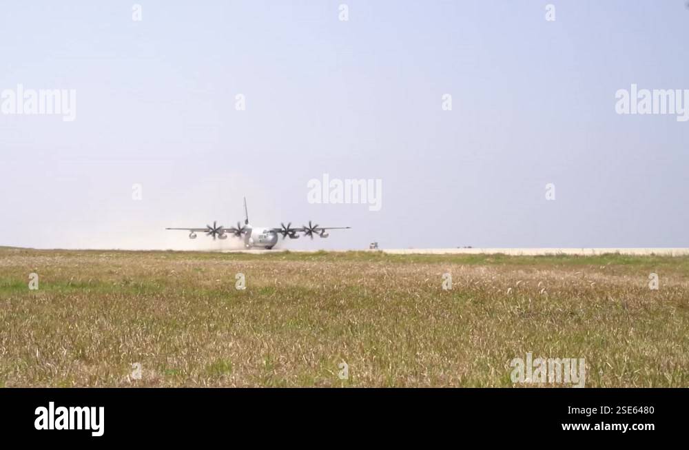C-130 Hercules landing on dusty runway Stock Video Footage - Alamy