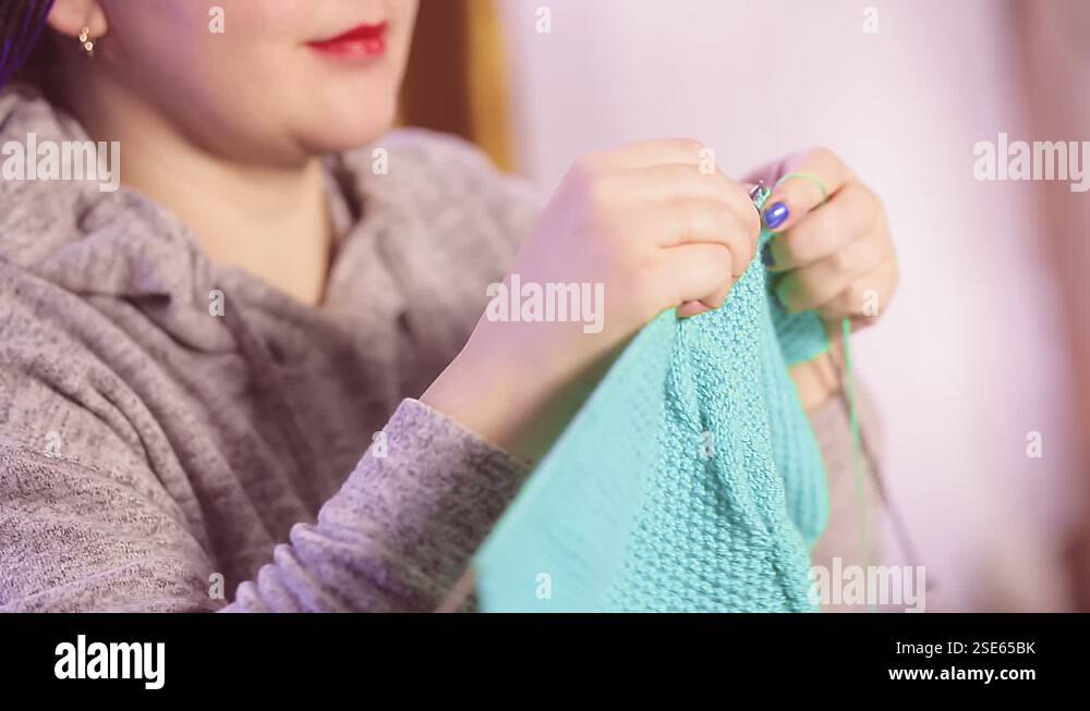 A woman is knitting a vest made of wool Stock Video Footage - Alamy