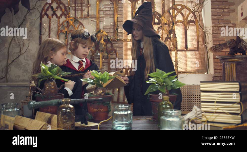 Students of a magic school are making note in a book, wizard teacher ...