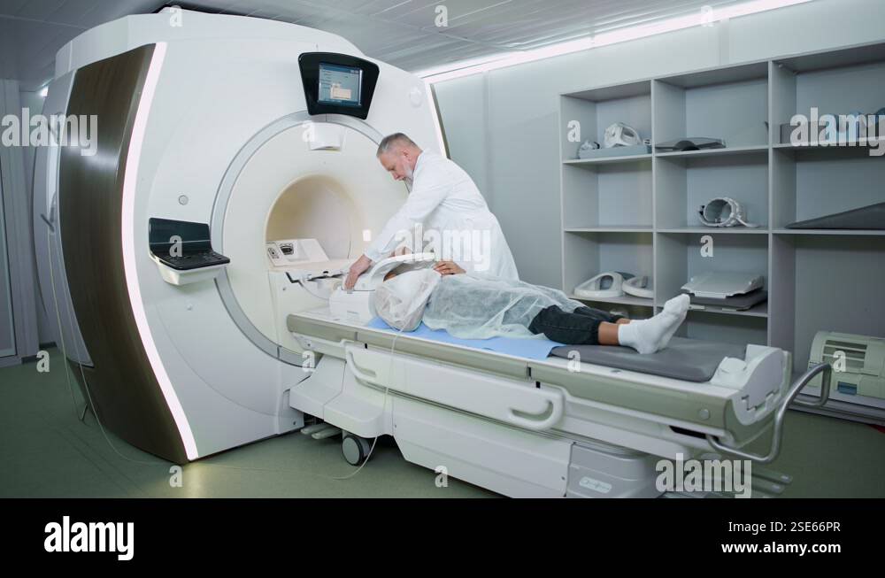 Magnetic resonance imaging in the modern hospital, adult man doctor ...