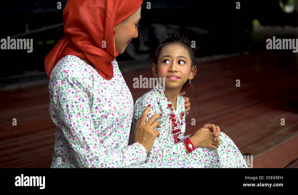 Mother and daughter moment, outdoor wearing traditional dresses for ...
