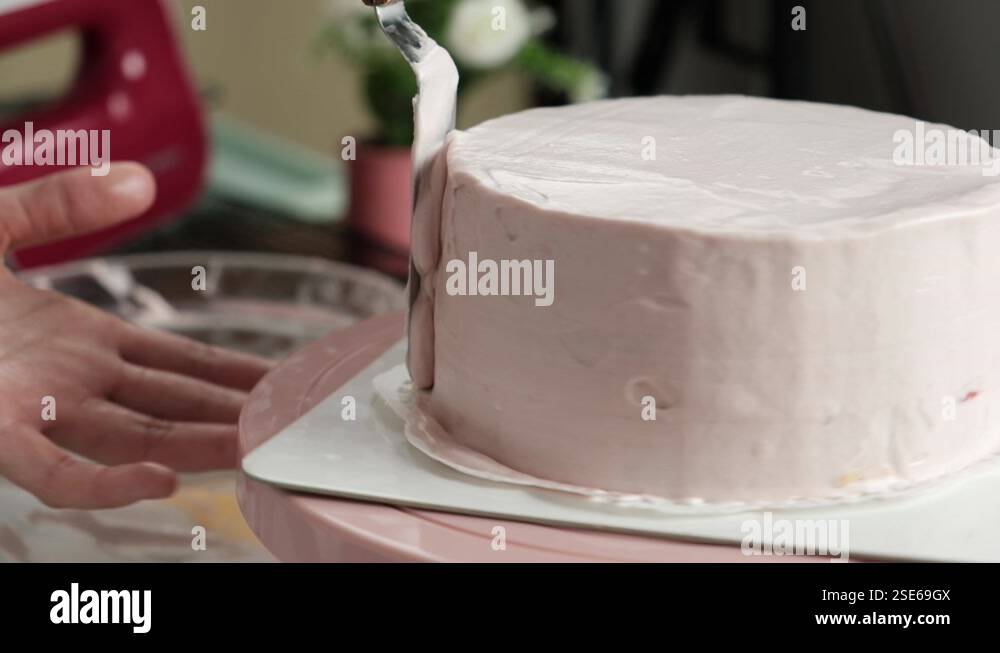 chef making cake by use spatula to scrape the whipped cream Stock Video ...