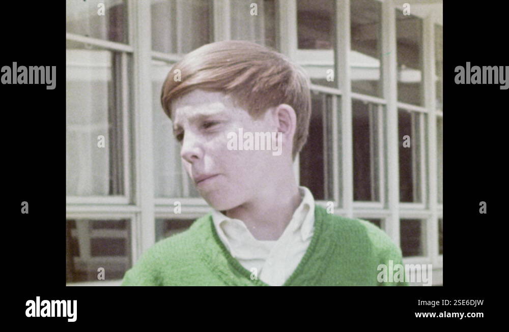 1960s: Outside school, students stand, hold books, talk. Home, boy ...