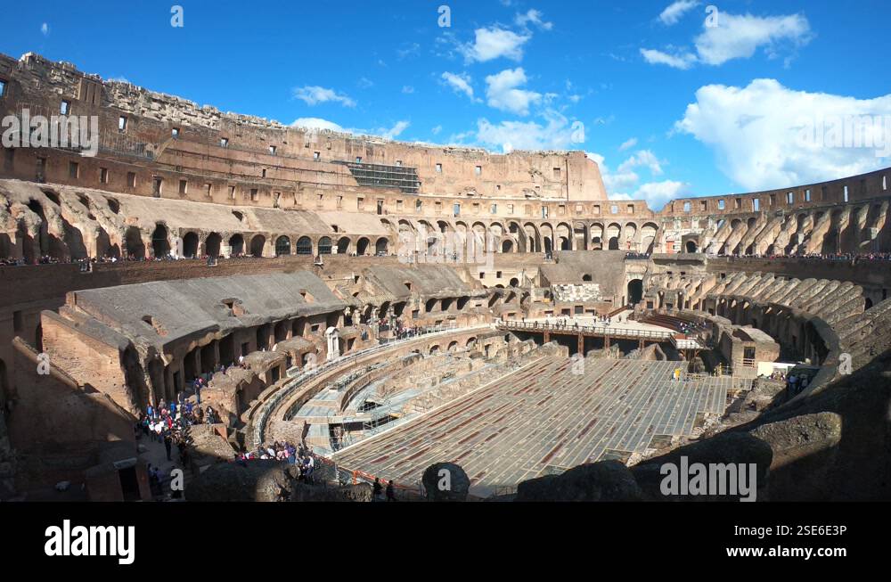 Inside the Colosseum in Rome, Italy. Camera pan from left to right on a ...