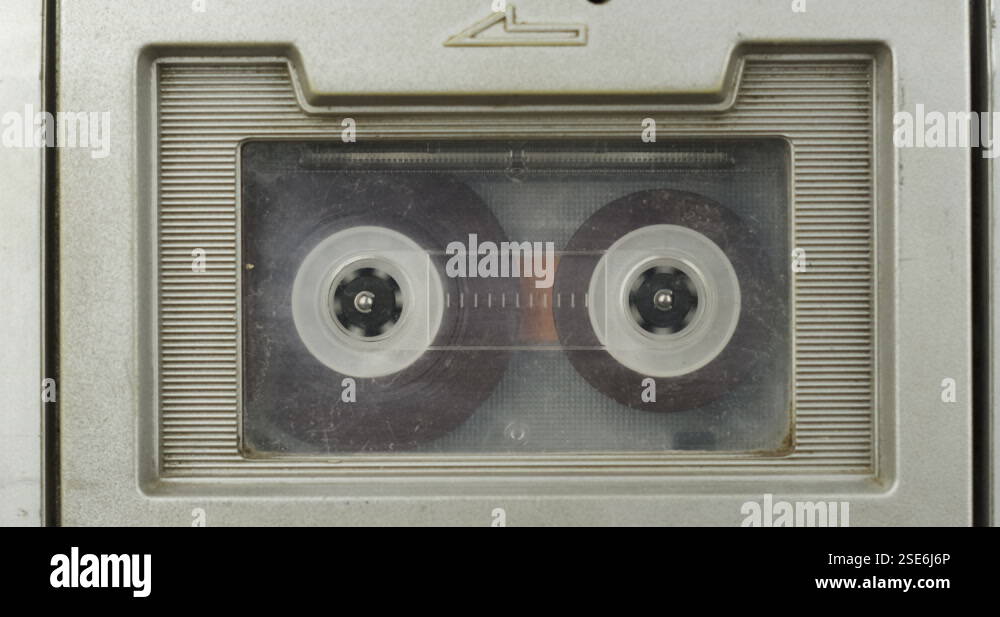Tape recorder rewinding audio cassette inserted therein. Rewind and ...