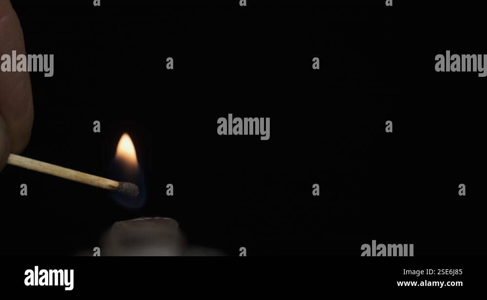 Firing up matches. Ignition close-up match of on matchbox and showing ...