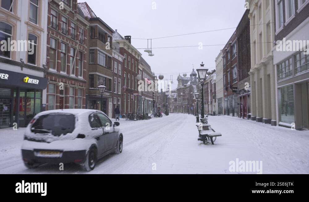 Leiden city buildings and Breestraat road covered in winter snow Stock ...