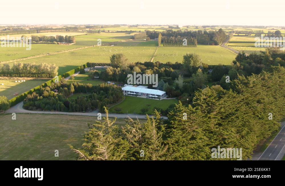 Wedding venue reveal from above high treeline in rural countryside ...