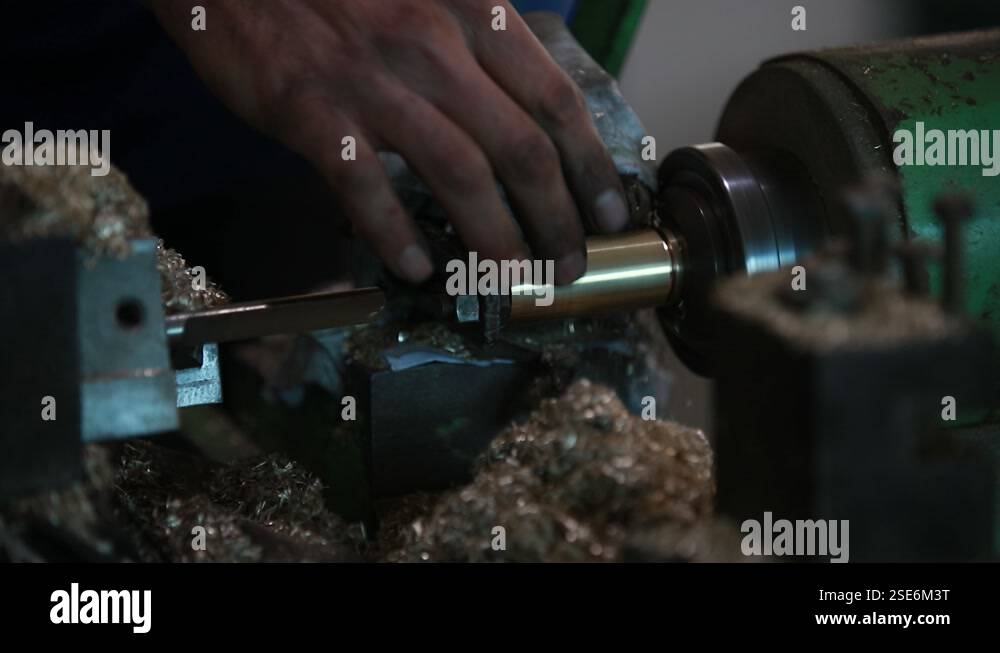 The turn-mill machine cutting groove at the metal shaft. The hi ...