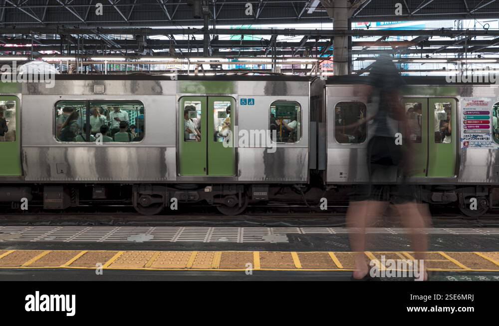 Passengers And Train Wagons At The Shibuya Railway Station In Tokyo ...