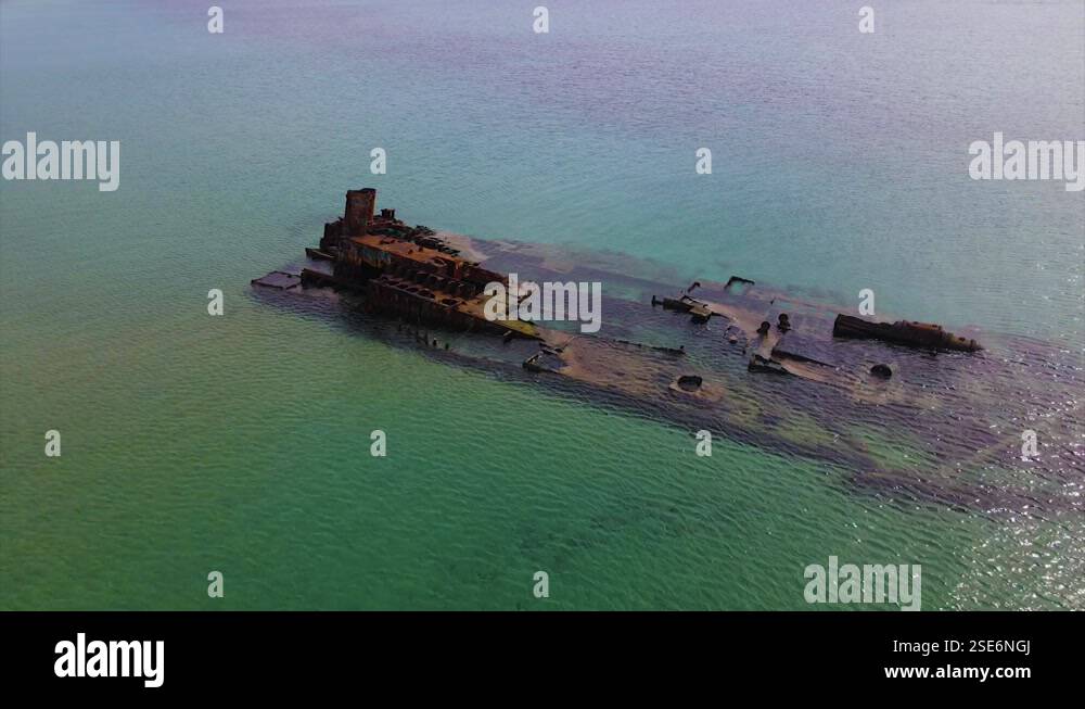 4K rotating clip over a shipwreck in the tropical beach of Epanomi ...