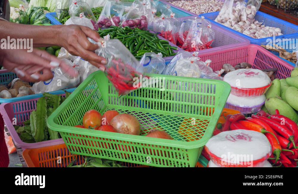 Woman choosing vegetables in a traditional Street market,Thailand ...