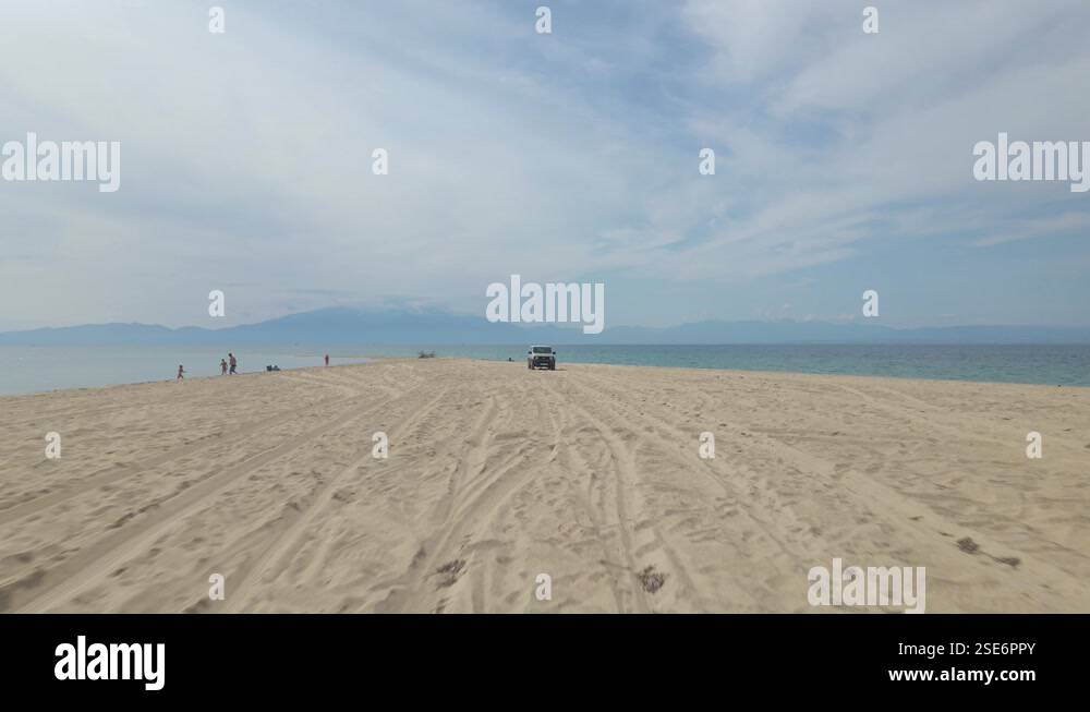 4k moving backwards close to the ground clip over a peninsula on the ...