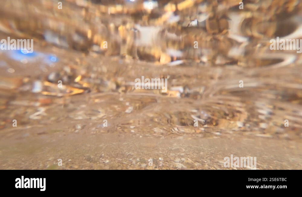 Pure and transparent water waves roll over camera. Bottom view Stock ...