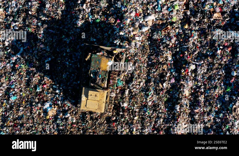 City Dump. The Bulldozer Compacts the Garbage on the Landfill. Wastes ...
