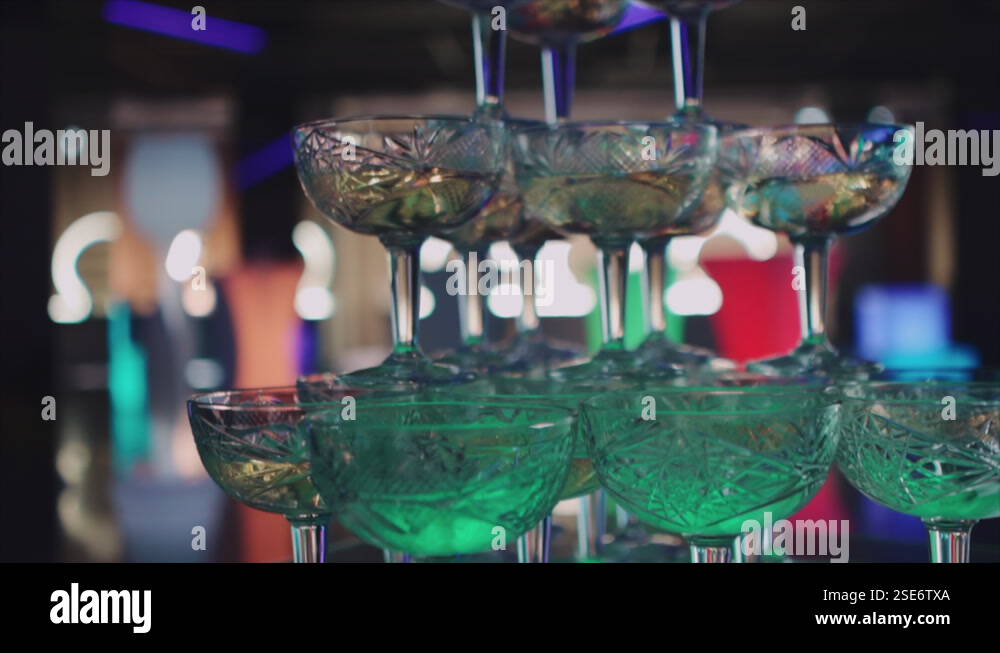 pouring cold alcohol with dry ice and festive champagne pyramid Stock ...